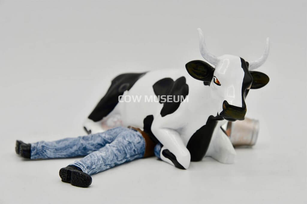 Cow Sitting on Man/ Ni Mu (medium) -Cow parade collection